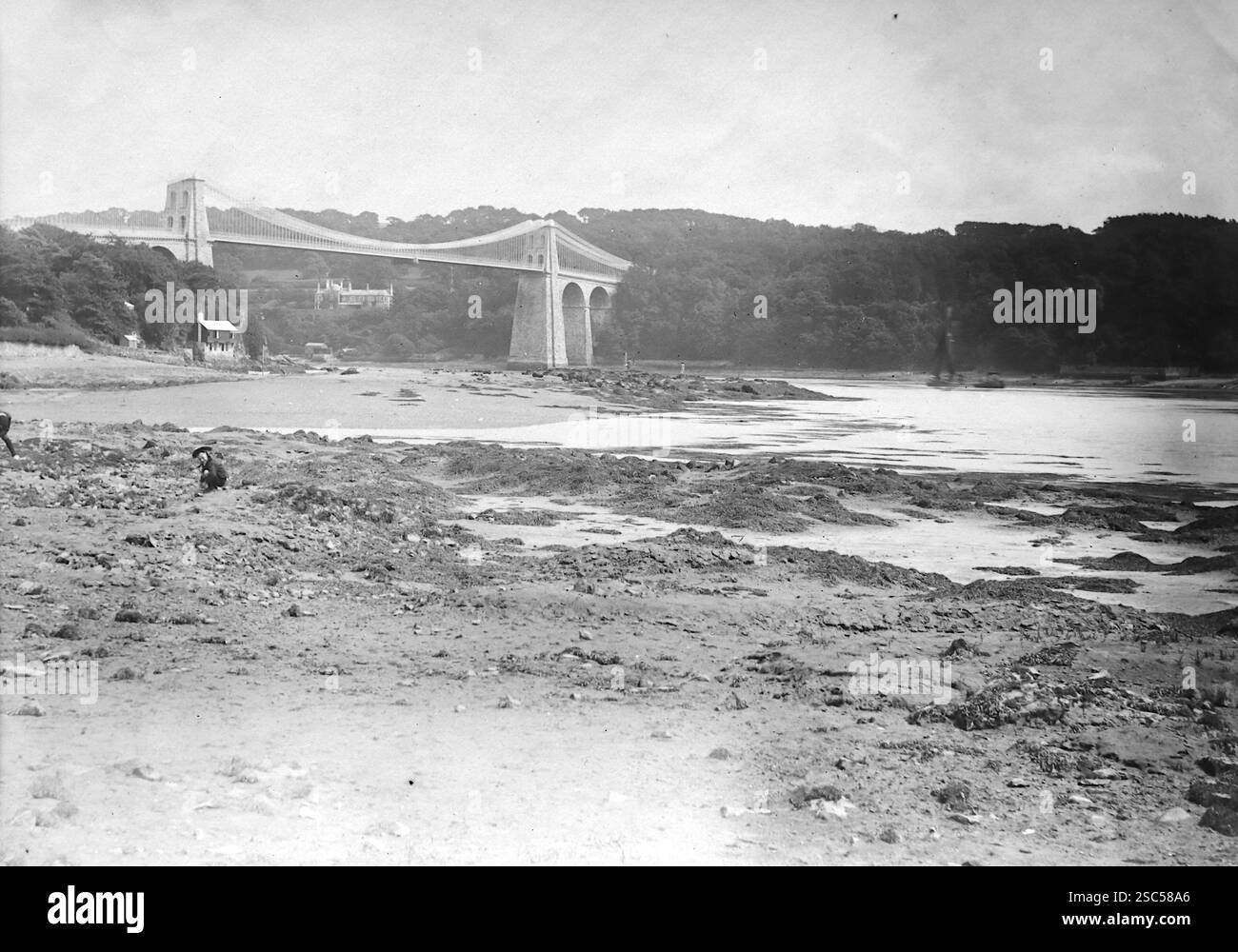 A suspension bridge across the Menai Strait (or Afon Menai in Welsh), a ...