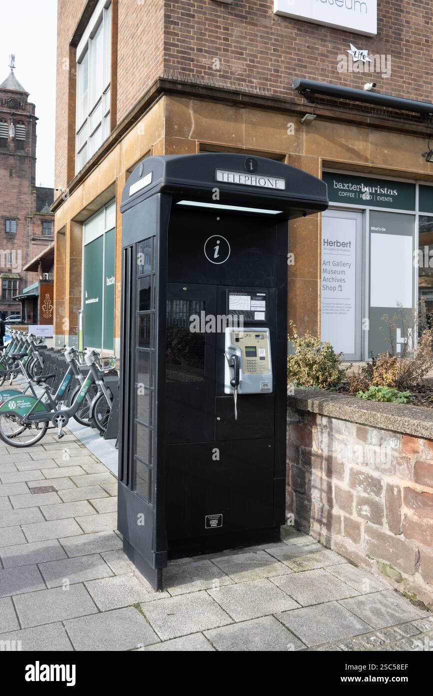 A black telephone box, Coventry city centre, West Midlands, England, UK ...
