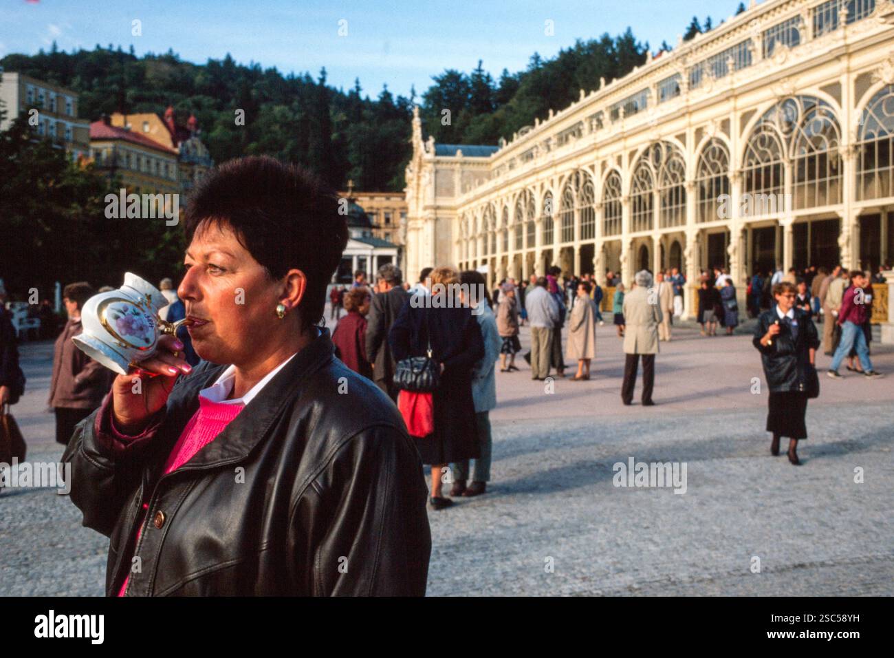 People drinking mineral spa water at one of the spas in the town of ...