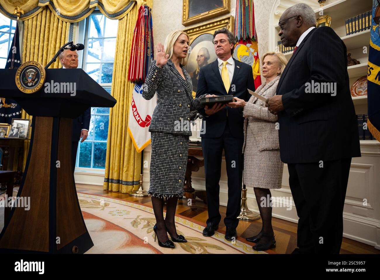 Pam Bondi is sworn in as attorney general by Supreme Court Justice Clarence Thomas while ...