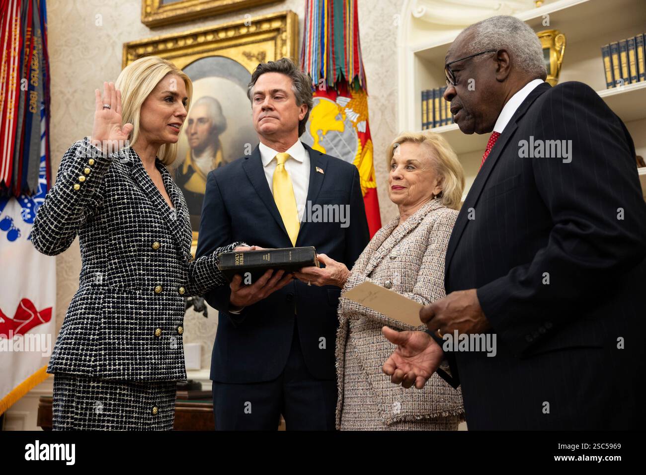 Pam Bondi is sworn in as attorney general by Supreme Court Justice Clarence Thomas while ...