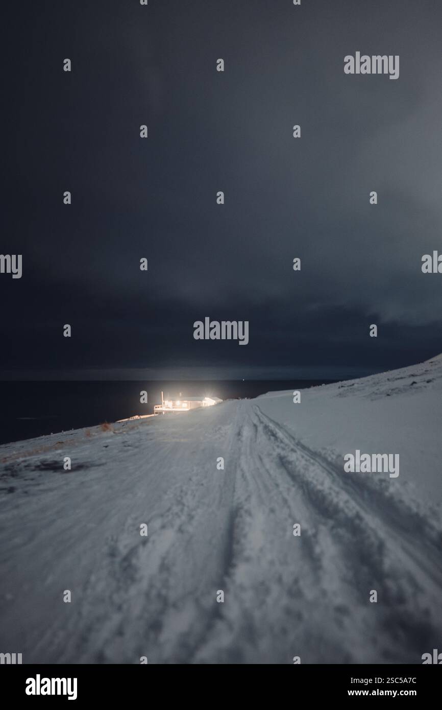 Snowy arctic road near Bjorndalen at night in Longyearbyen, Svalbard ...