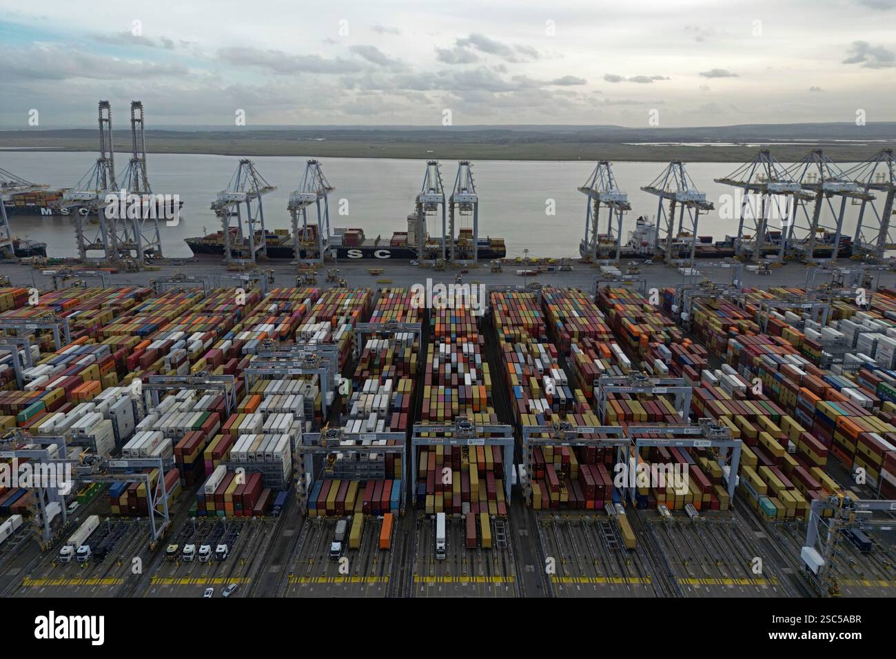 Shipping containers wait to be processed at London Gateway port, in ...