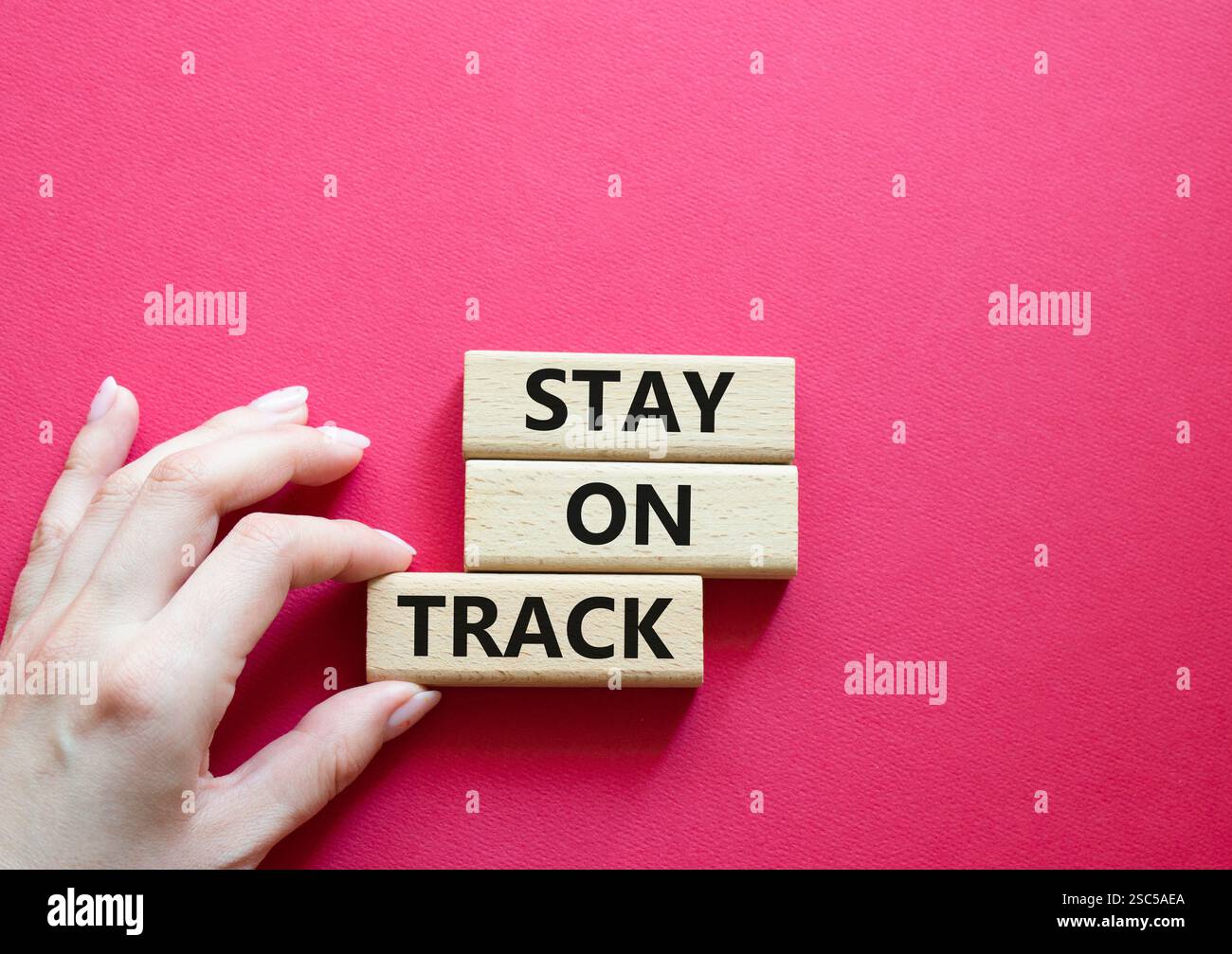 Stay on track symbol. Wooden blocks with words 'Stay on track ...