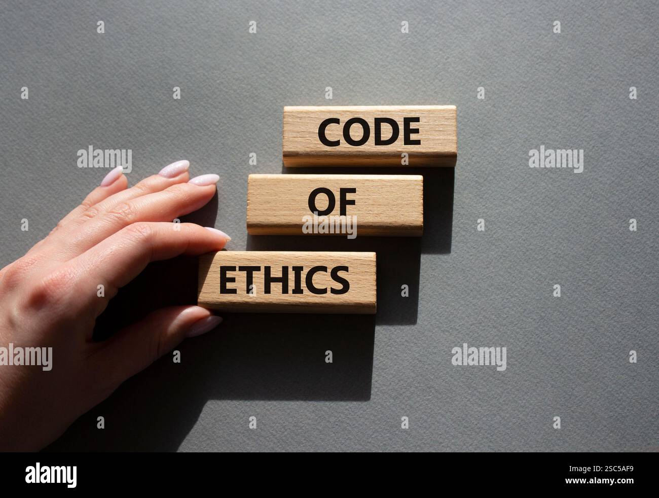 Code of ethics symbol. Concept words Code of ethics on wooden blocks ...