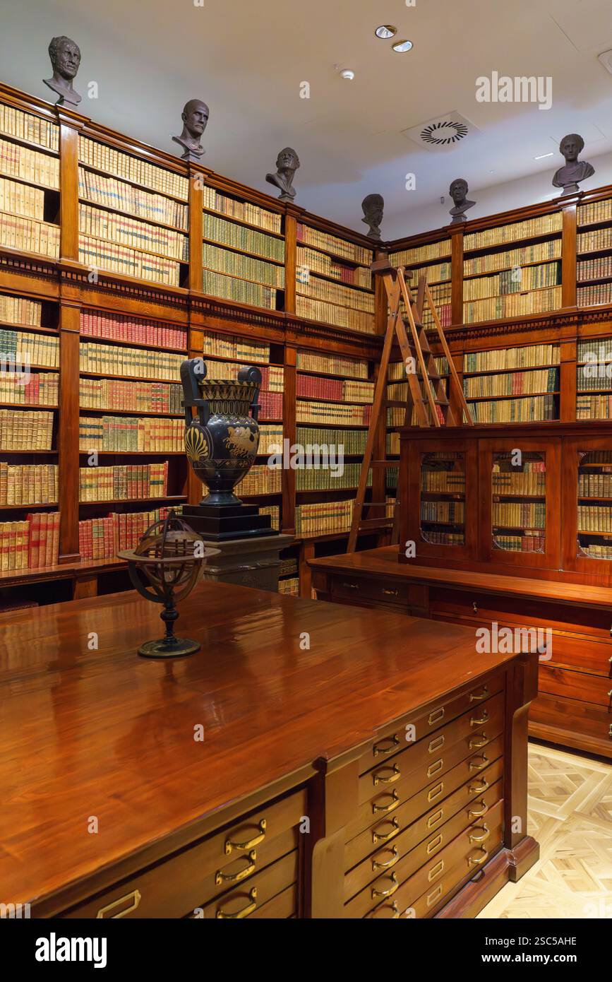 Interior of a historic library with shelves of old books and antique ...
