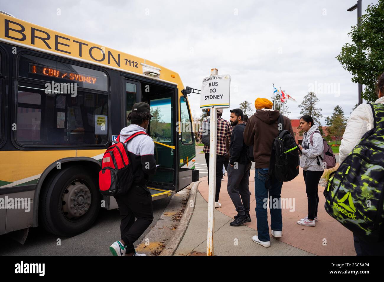 Sydney, Canada. 18th Oct, 2023. Students board a bus after class at ...