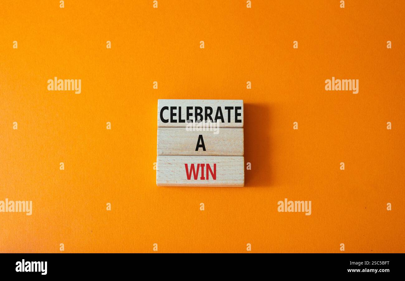 Celebrate a win symbol. Concept words Celebrate a win on wooden blocks ...
