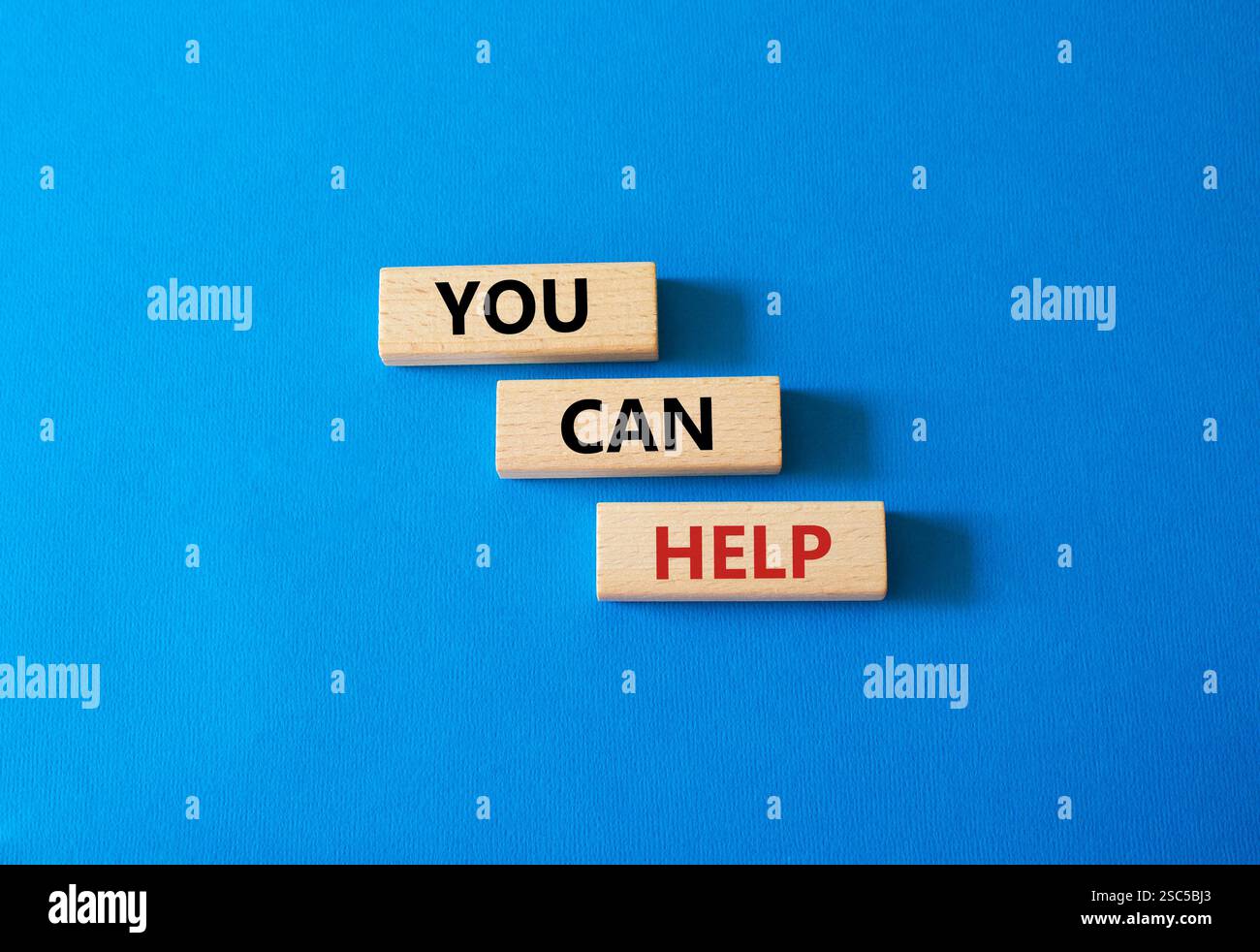 You can help symbol. Wooden blocks with words You can help. Beautiful ...