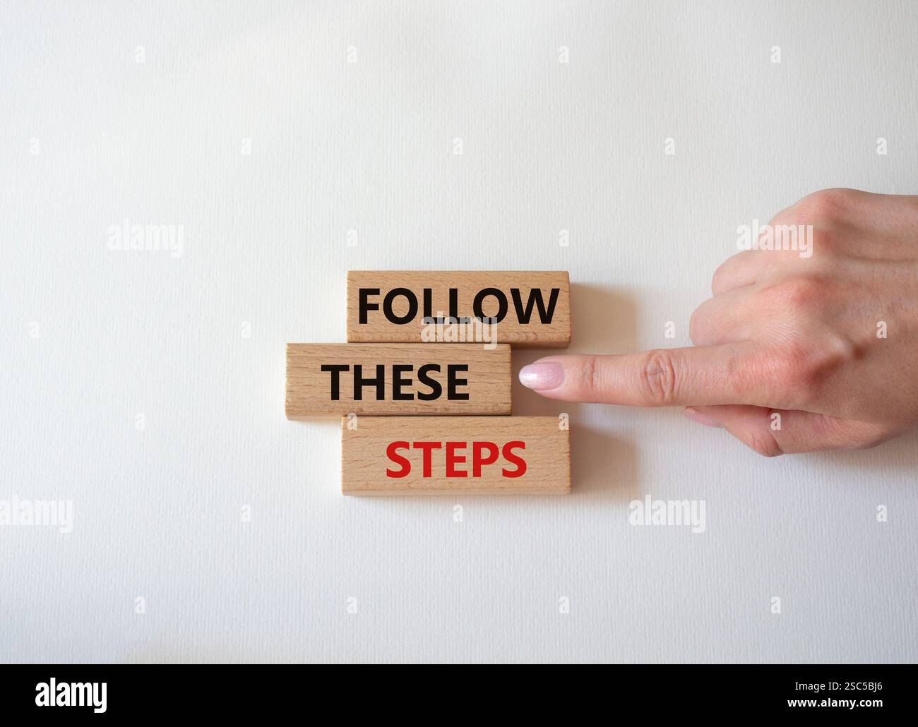 Follow these steps symbol. Wooden blocks with words Follow these steps ...