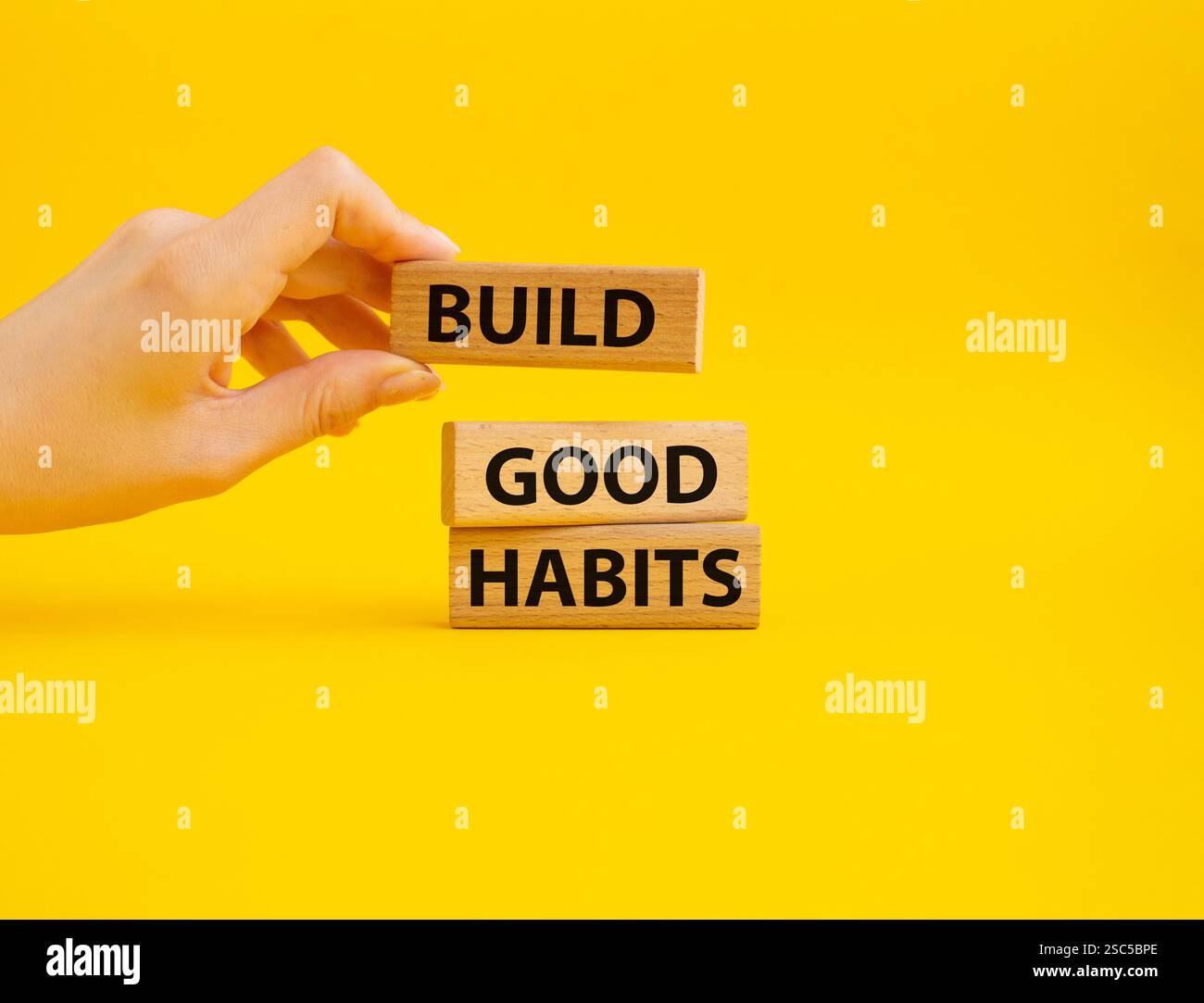 Build good habits symbol. Wooden blocks with words 'Build good habits ...