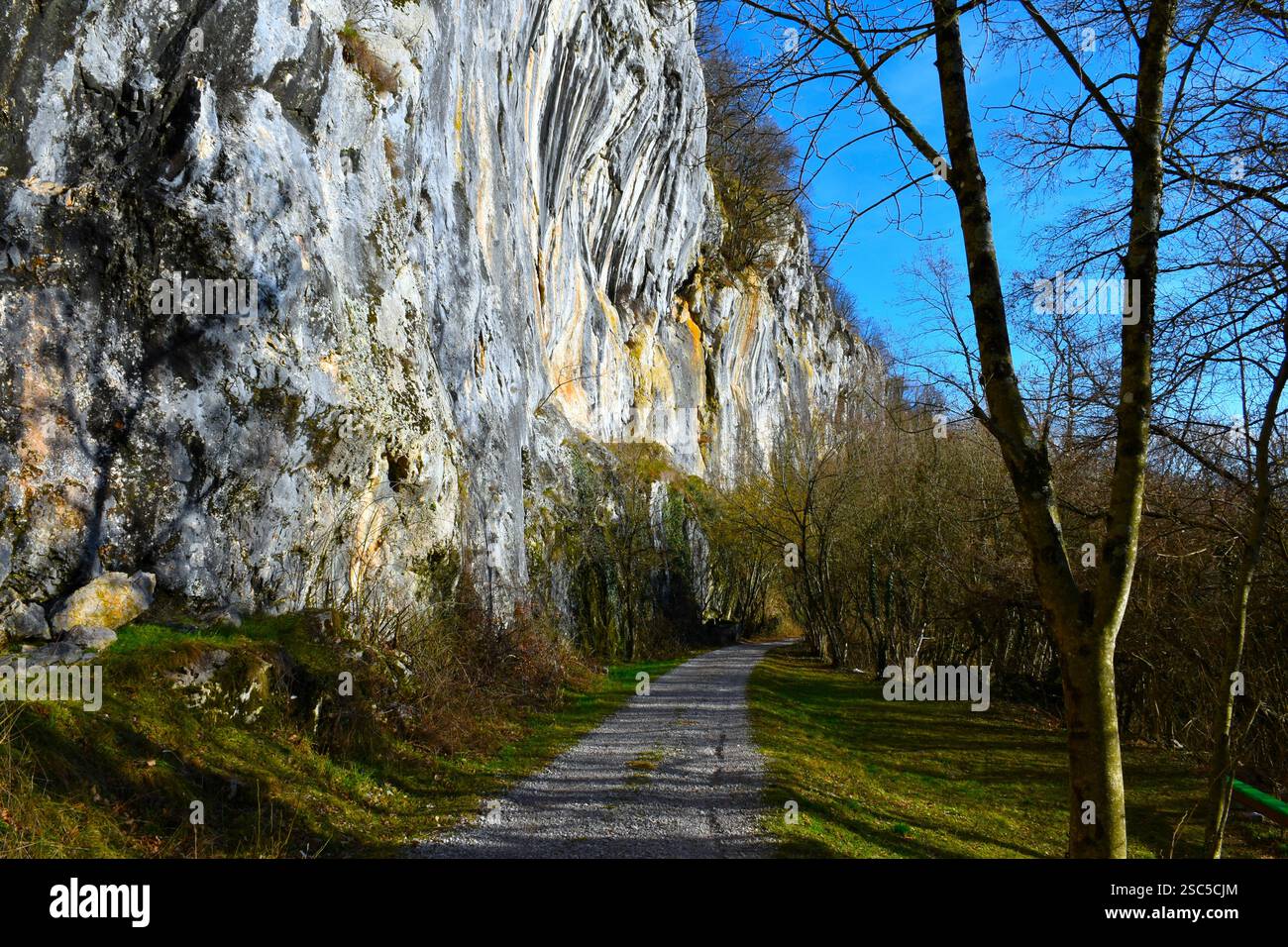 Limestone rock precipice and a gravel road bellow at Podtabor in ...