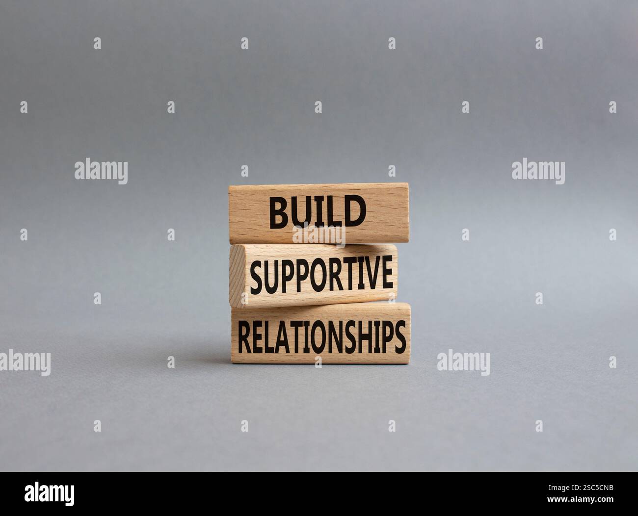Build Supportive Ralationships symbol. Wooden blocks with words Build ...