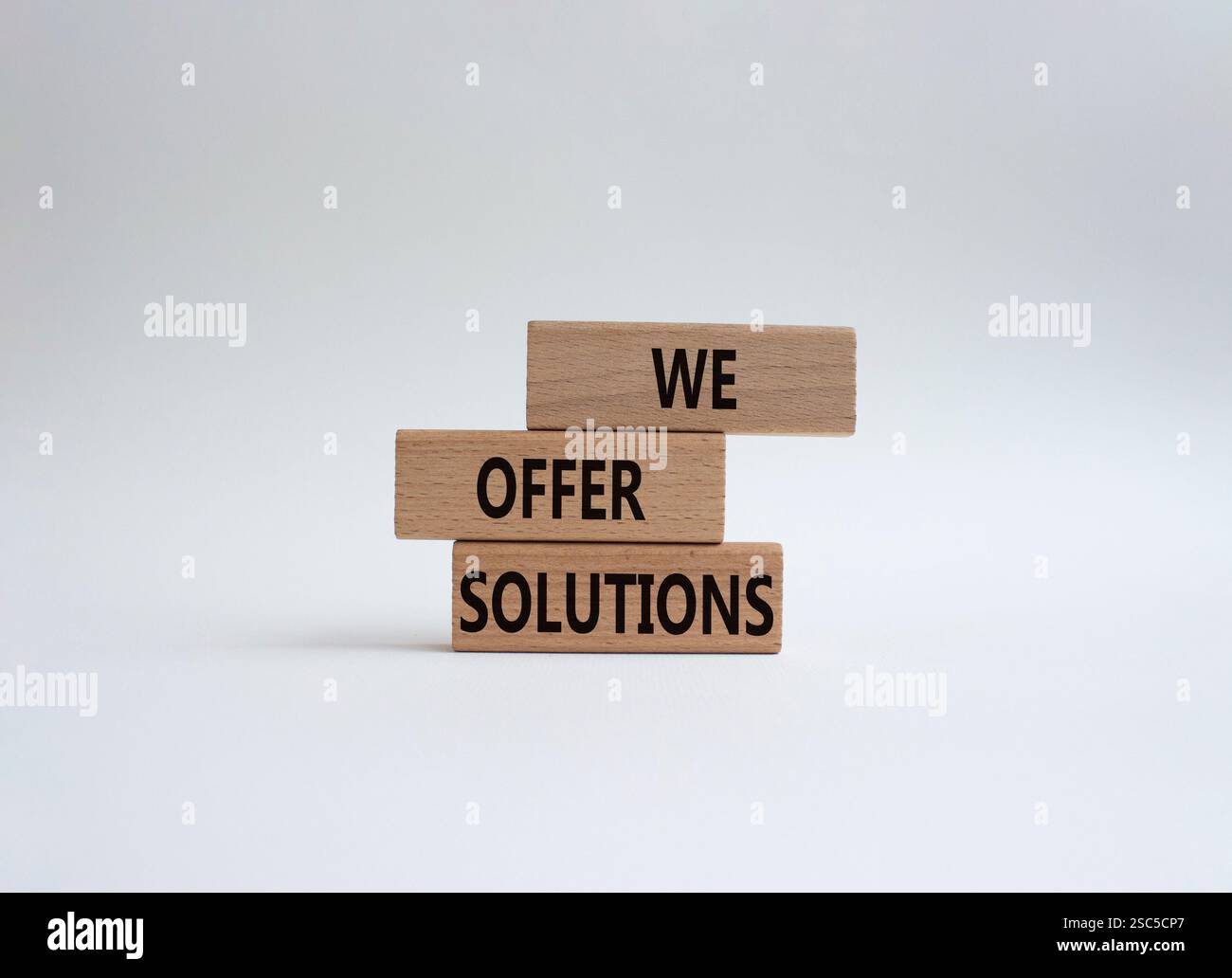 We offer solutions symbol. Concept words We offer solutions on wooden ...