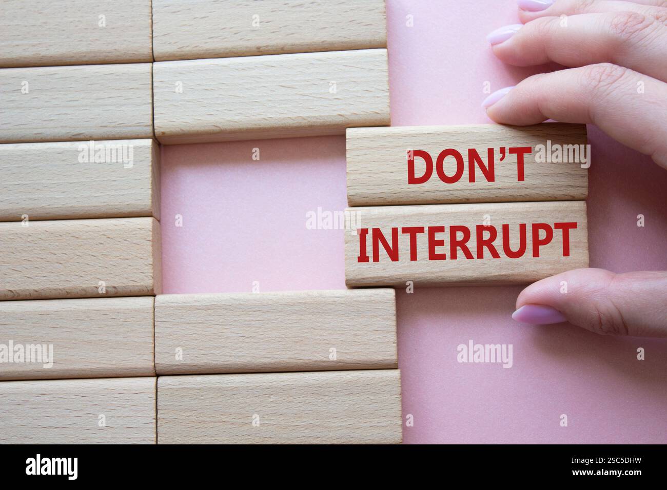 Dont interrupt symbol. Concept word Dont interrupt on wooden blocks ...