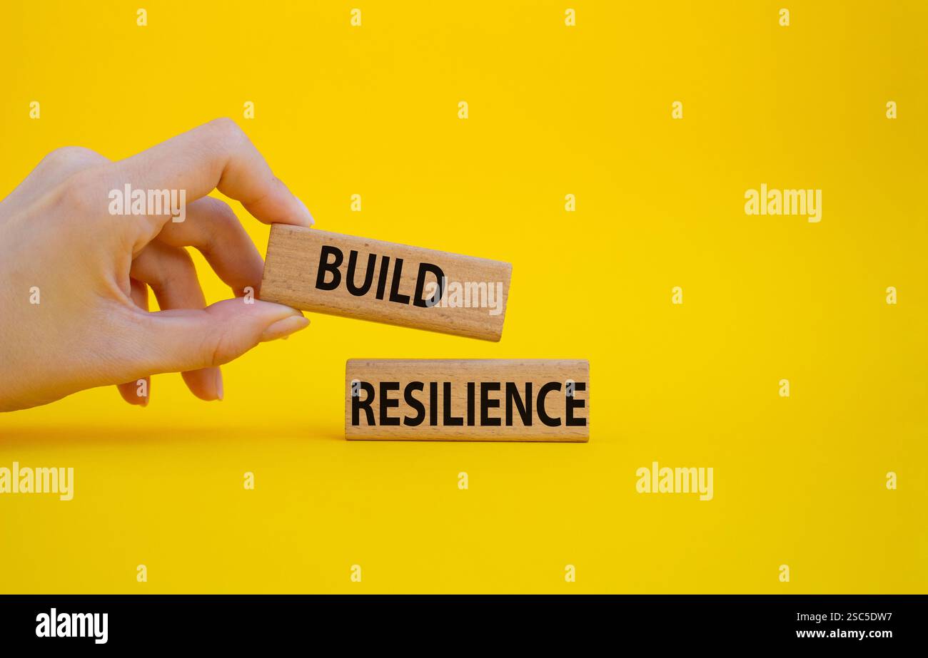 Build resilience symbol. Wooden blocks with words Build resilience ...