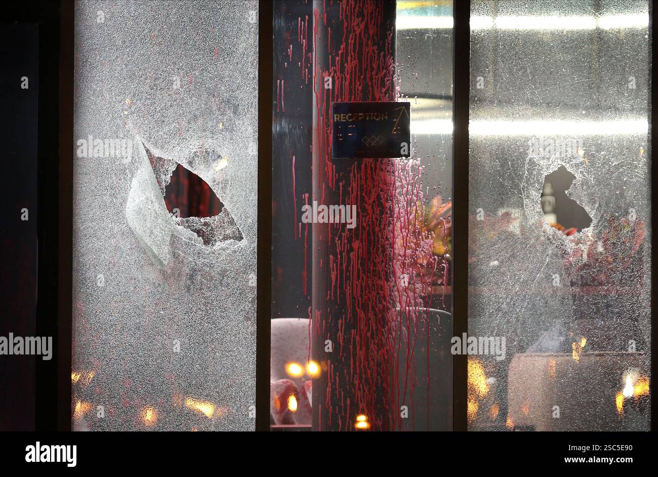 Ground floor windows are smashed and sprayed with red paint at Allianz ...