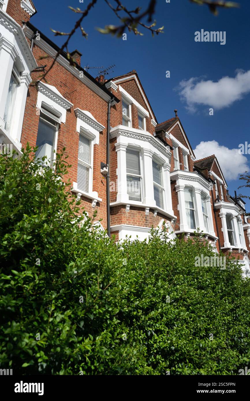Victorian terraced houses, likely in London, England. White window ...