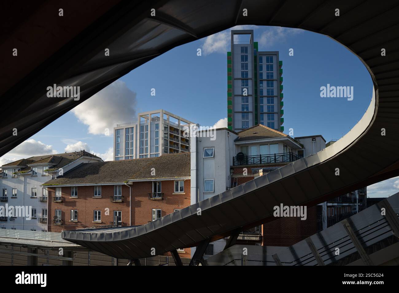 Modern apartment buildings, including a high-rise, are seen from ...