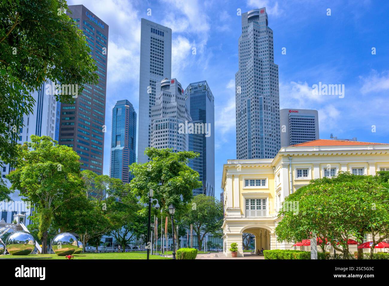 The towering skyscrapers of Singapore's financial district loom over ...