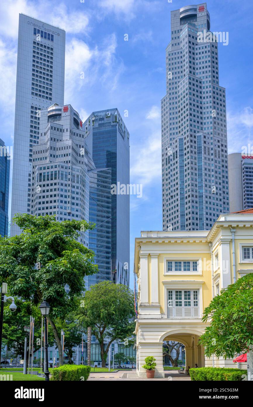 The towering skyscrapers of Singapore's financial district loom over ...