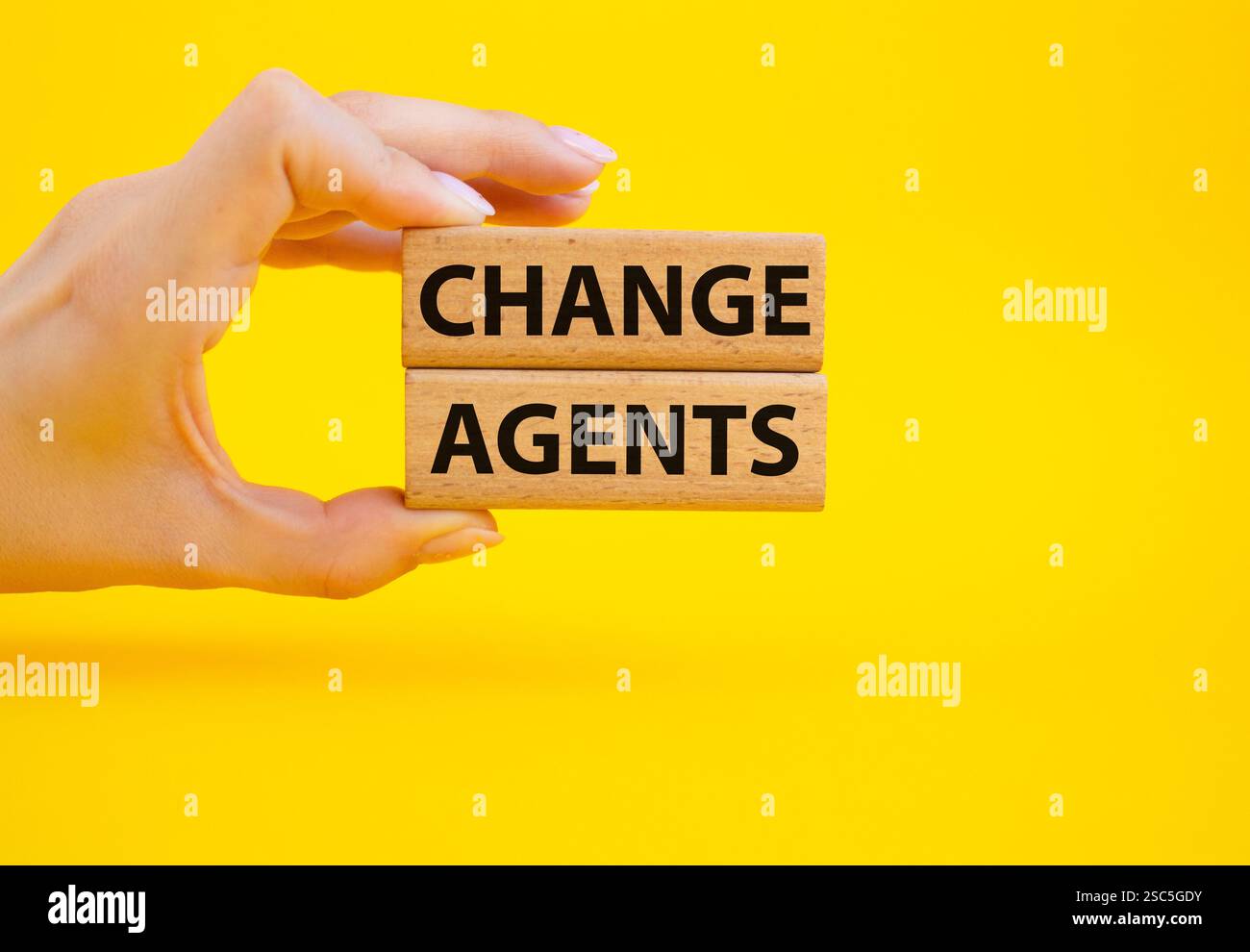 Change agents symbol. Concept word Change agents on wooden blocks ...