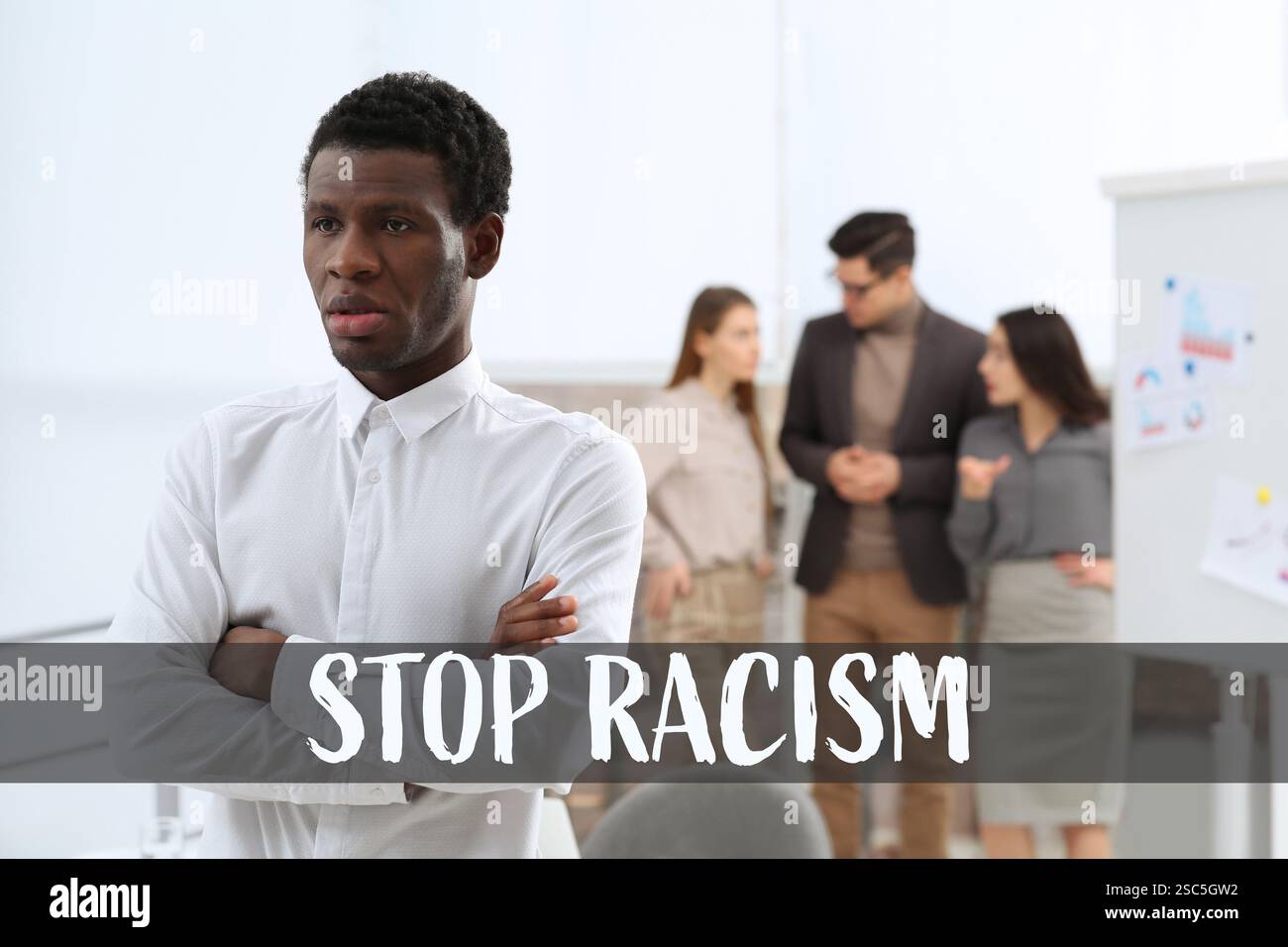 Stop racism. Man suffering from discrimination at work Stock Photo - Alamy