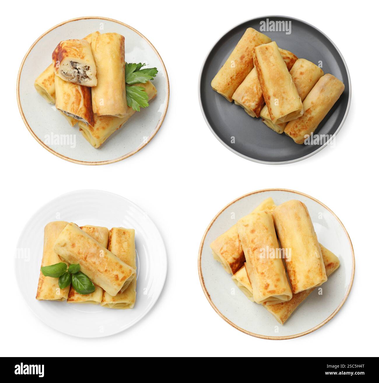 Delicious rolled stuffed crepes isolated on white, set. Top view Stock ...