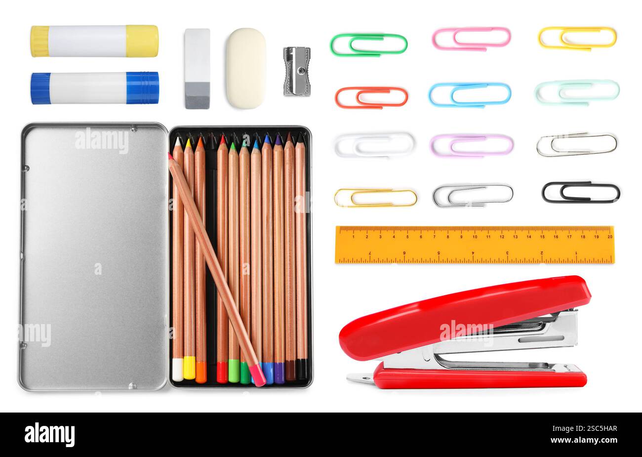 Paper clips in different colors and other stationery isolated on white ...