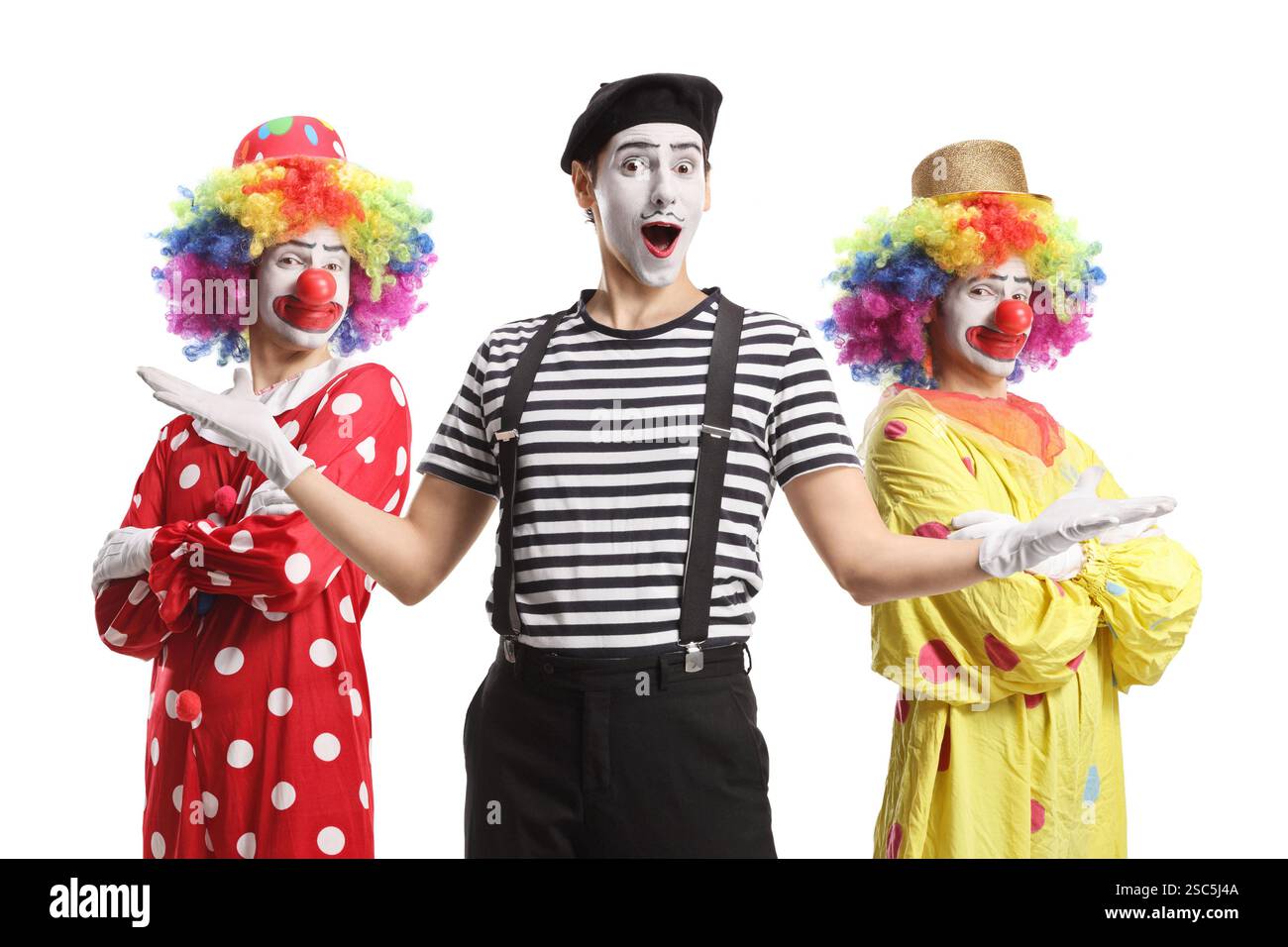 Mime posing with crossed arms in front of clowns isolated on white ...