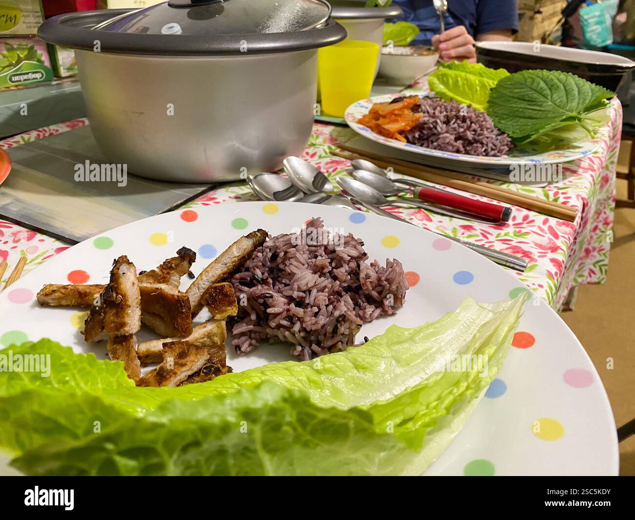 Asian inspired cuisine with rice, romaine lettuce and grilled pork to ...