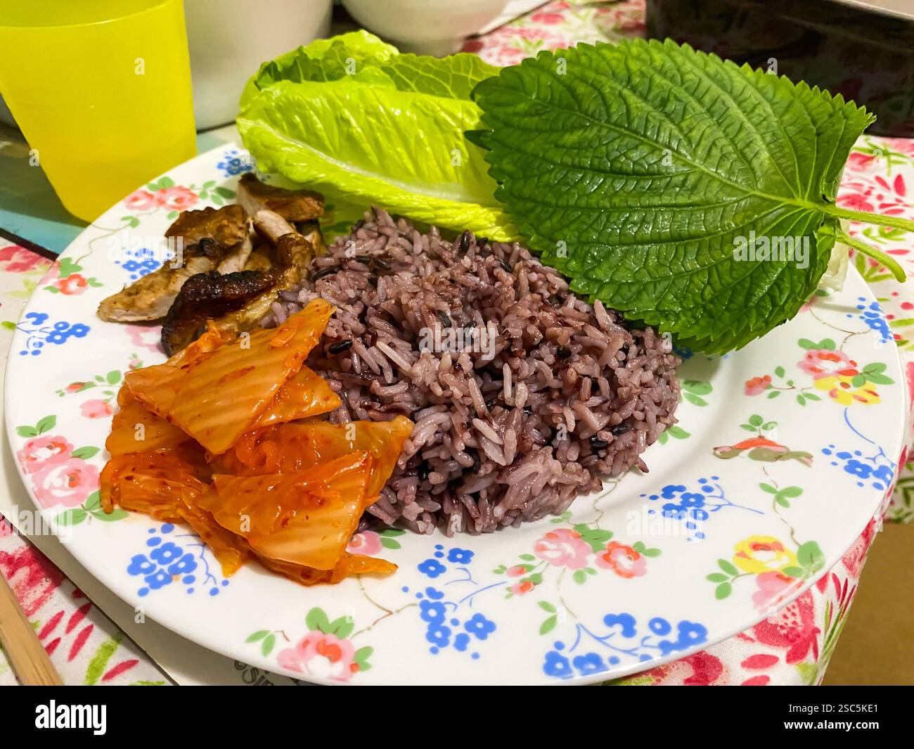 Asian inspired cuisine with rice, romaine lettuce and grilled pork to ...
