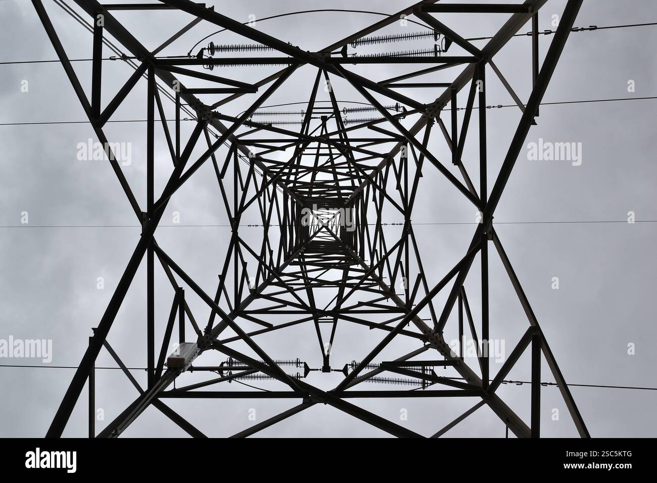 High-voltage tower seen from below Stock Photo - Alamy