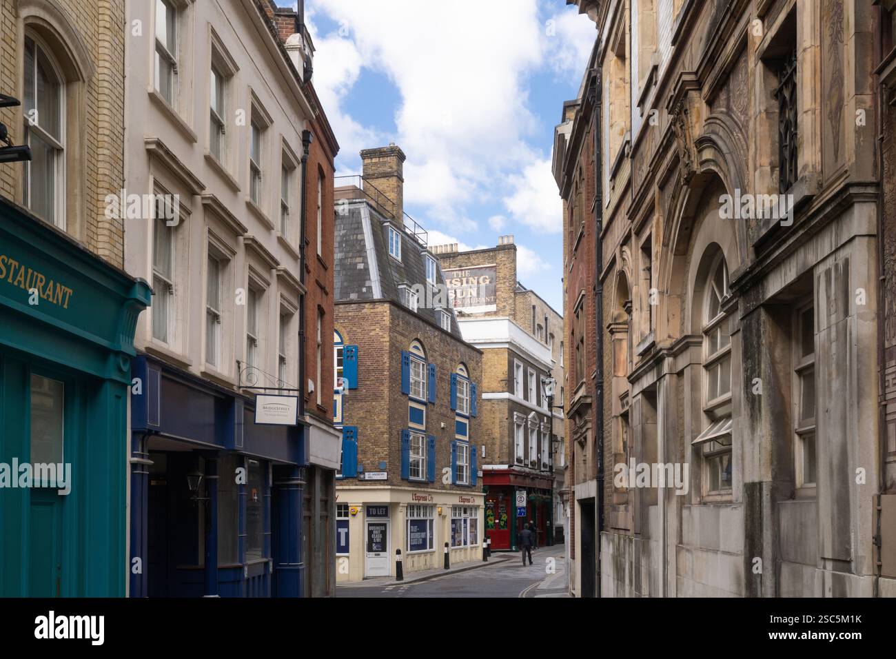 Narrow street scene in London, likely near St. Andrews Hill, showing ...