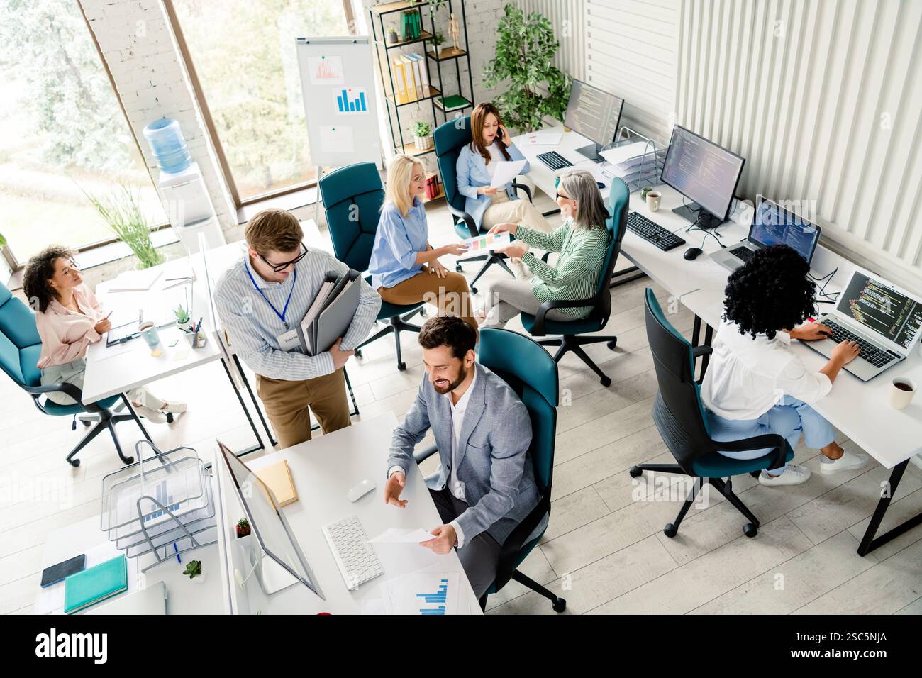 Group of professionals collaborating and working in a modern office ...