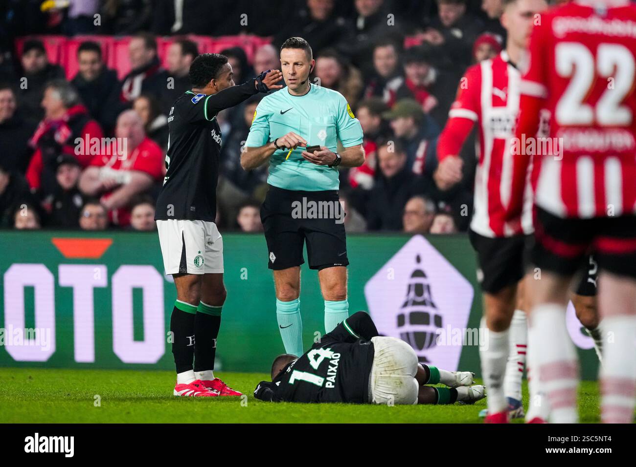 Eindhoven, The Netherlands. 05th Feb, 2025. Eindhoven - Quinten Timber of Feyenoord, Referee Pol ...