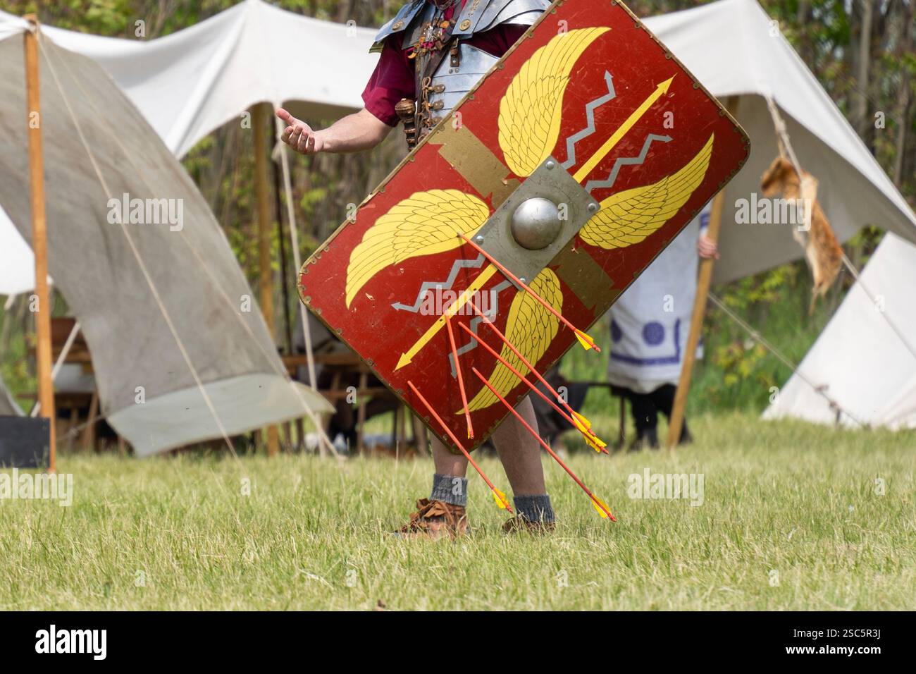 Roman legionary with shield pierced by arrows Stock Photo - Alamy