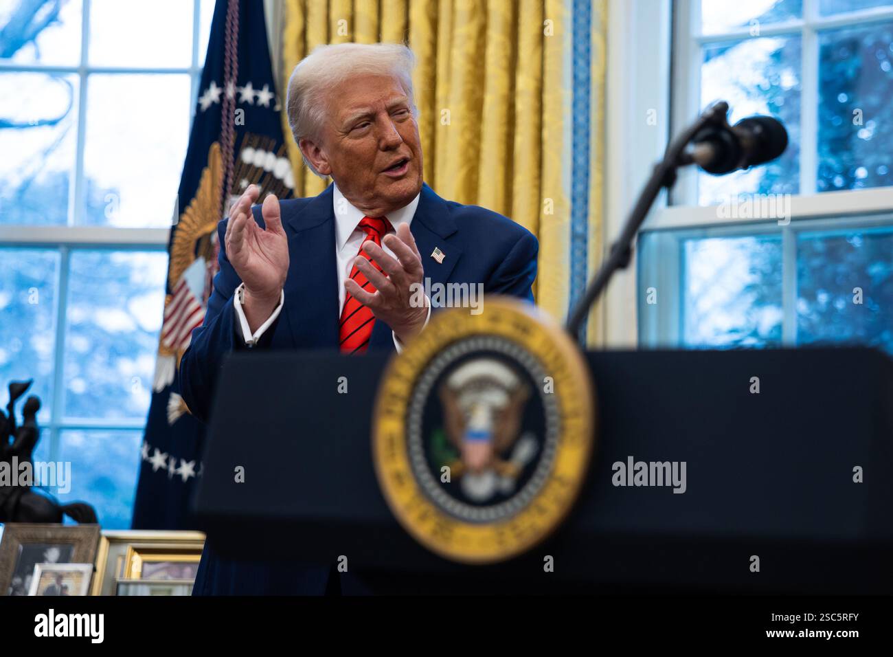 United States President Donald Trump applauds after Pam Bondi was sworn ...