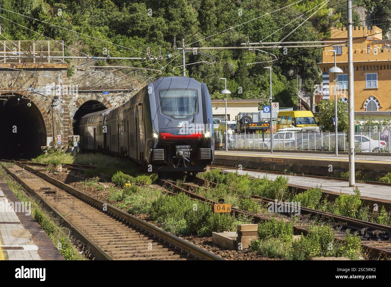 Hitachi commuter train arriving at Monterosso train station platform ...