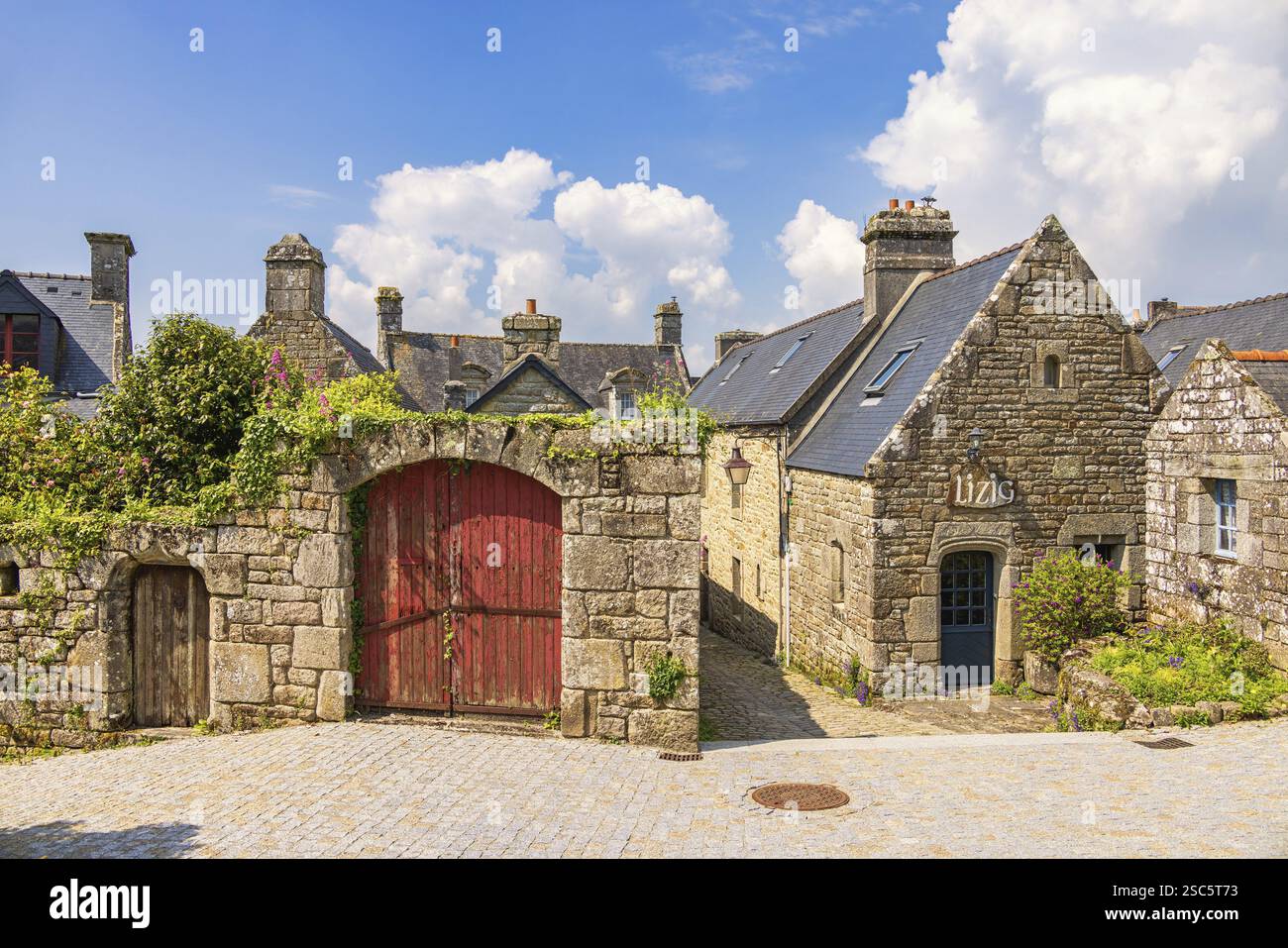 Old picturesque houses and alleys in the old French town of Locronan ...