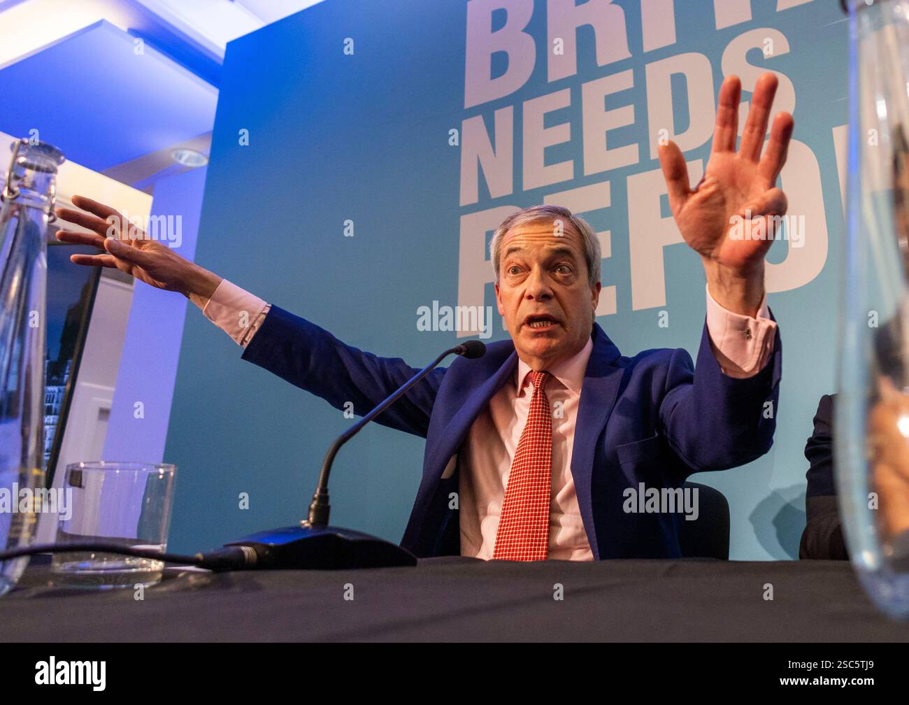 London, UK. 5th Feb, 2025. Nigel Farage, Leader of Reform UK answers ...