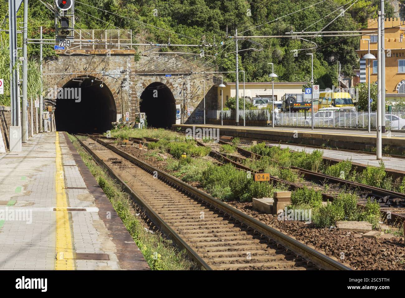 Monterosso railway station platform and train tracks with tunnels ...
