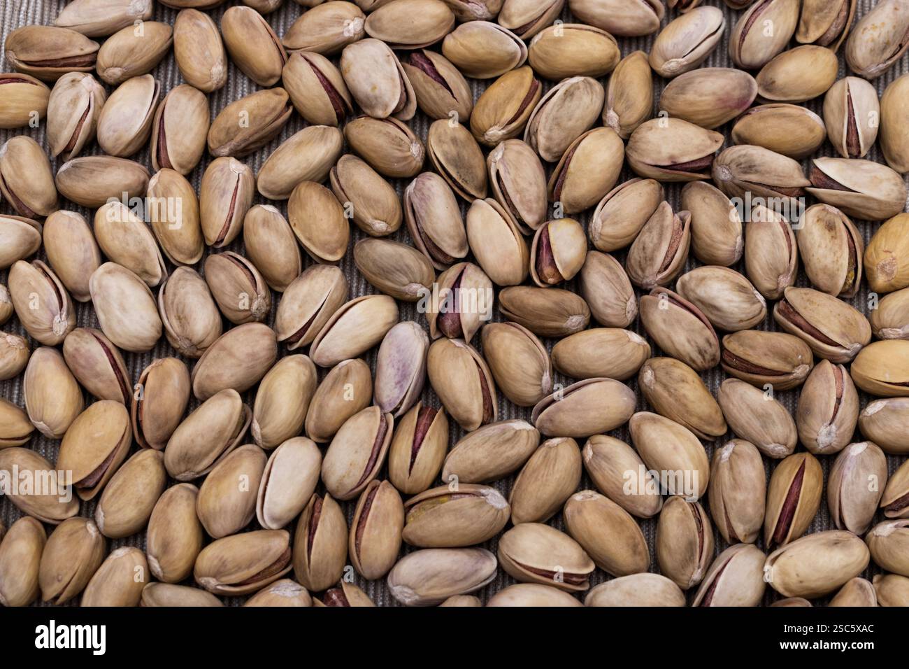 Roasted pistachio nuts in shells. Natural food peanuts stacked background Stock Photo - Alamy