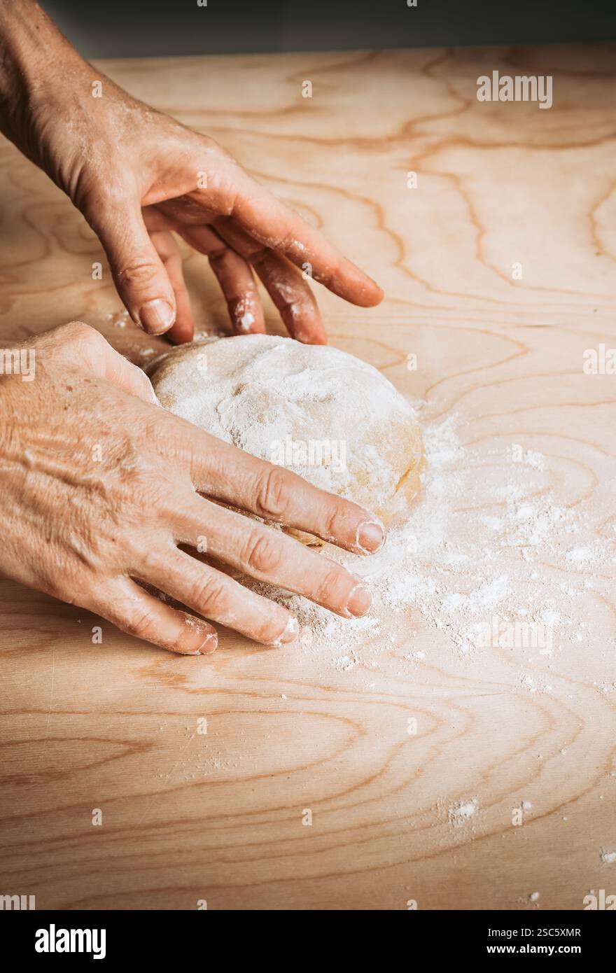 Homemade pasta preparation in Tuscany. The image shows the hands of a ...