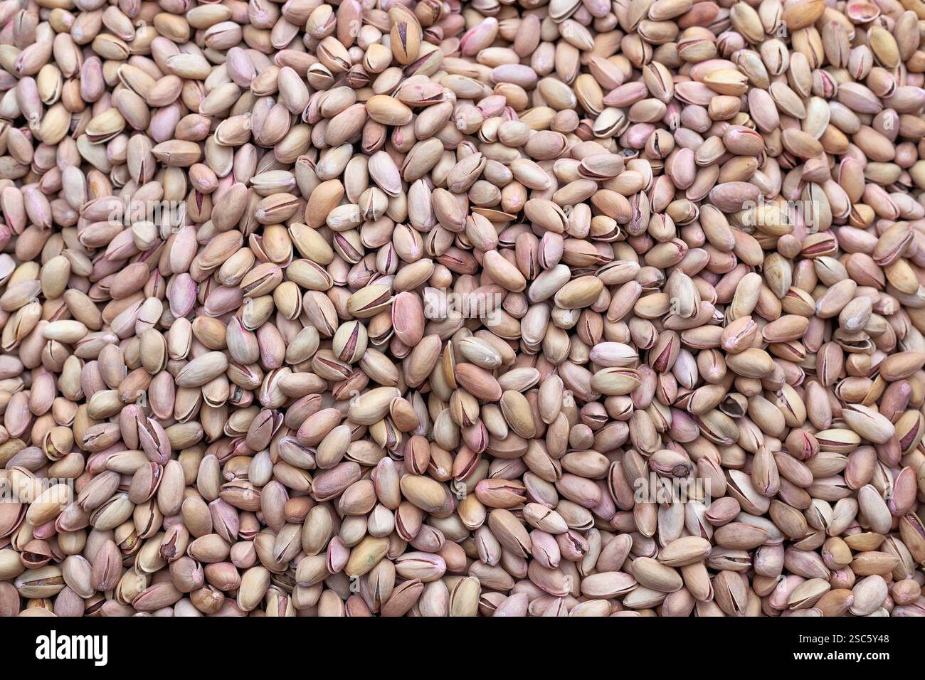 Roasted pistachio nuts in shells. Natural food peanuts stacked ...