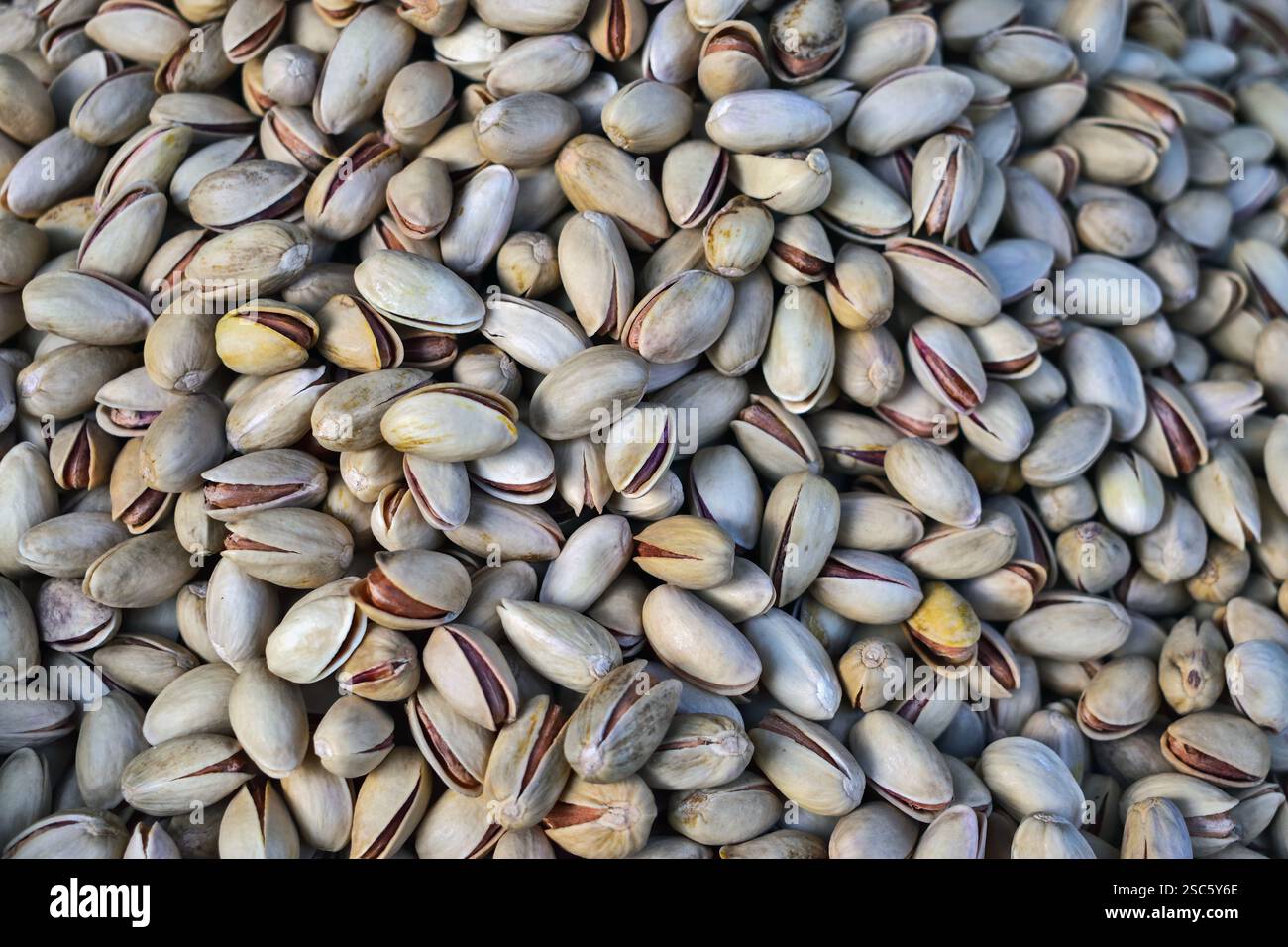 Roasted pistachio nuts in shells. Natural food peanuts stacked background Stock Photo - Alamy