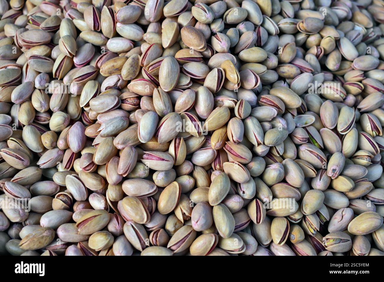 Roasted pistachio nuts in shells. Natural food peanuts stacked background Stock Photo - Alamy