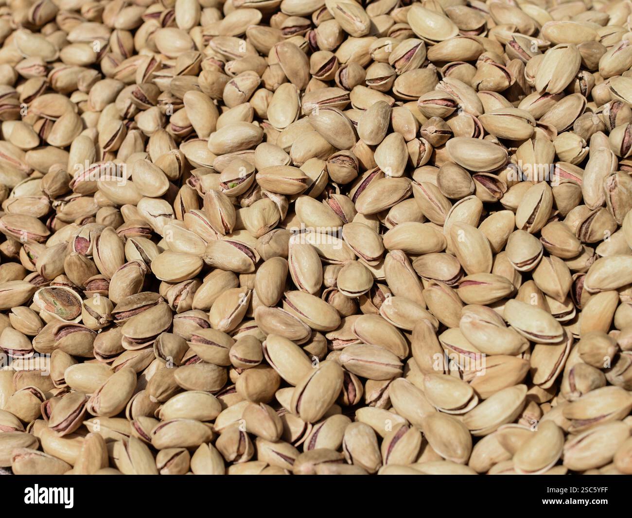 Roasted pistachio nuts in shells. Natural food peanuts stacked background Stock Photo - Alamy
