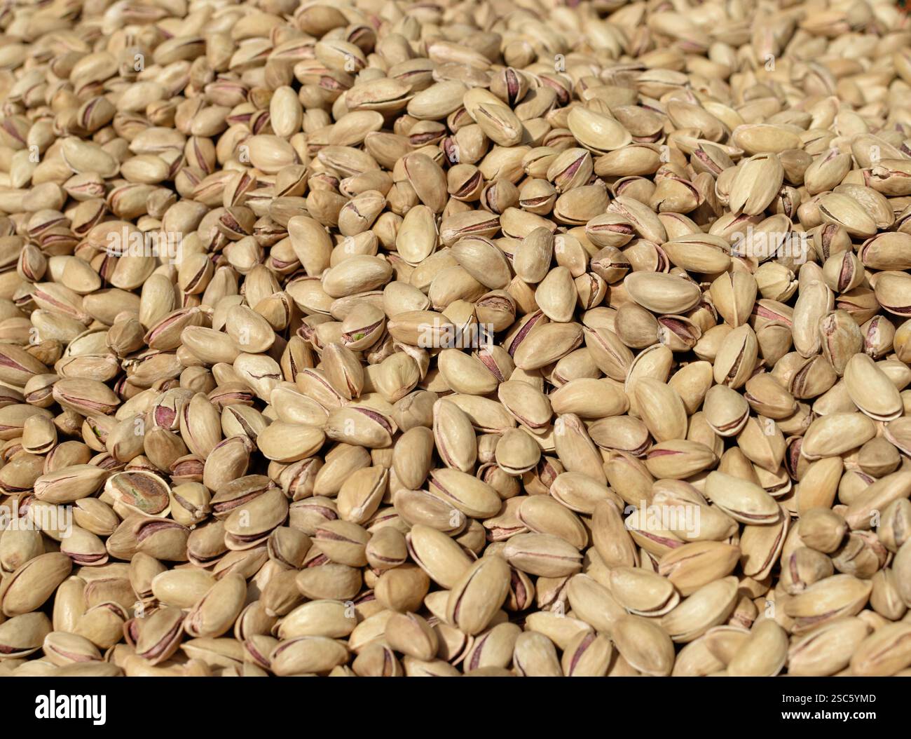 Roasted pistachio nuts in shells. Natural food peanuts stacked background Stock Photo - Alamy
