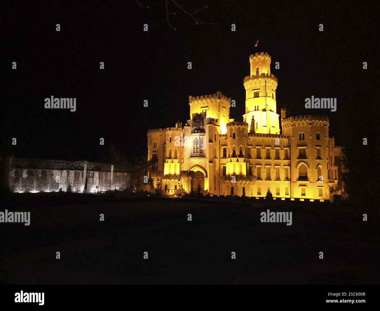 Illuminated castle at night. Hluboka is a historic chateau situated in ...